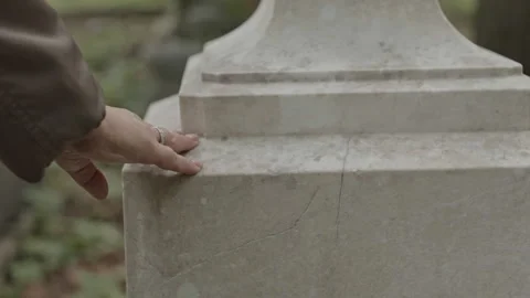 Hand of Woman Touching White Granite Mem... | Stock Video | Pond5