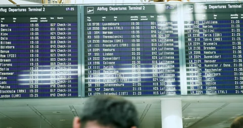 Handheld footage - airport timetable wit... | Stock Video | Pond5
