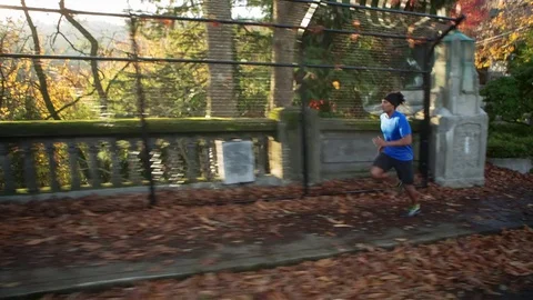 Handheld shot of male athlete running on... | Stock Video | Pond5