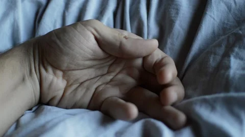 handicapped man's hand paralyzed on a be... | Stock Video | Pond5