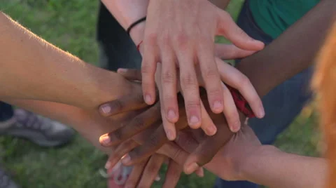 Hands of all colours and races stack tog... | Stock Video | Pond5