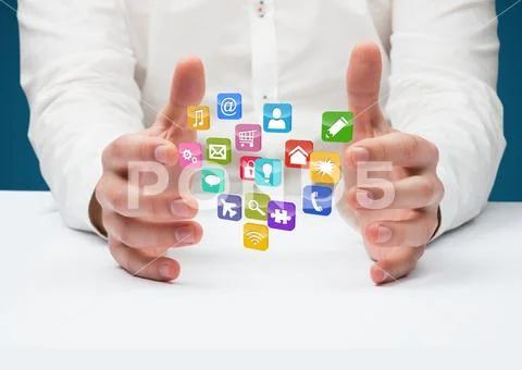 Hands with application icons in the desk. Blue background Stock Photo ...