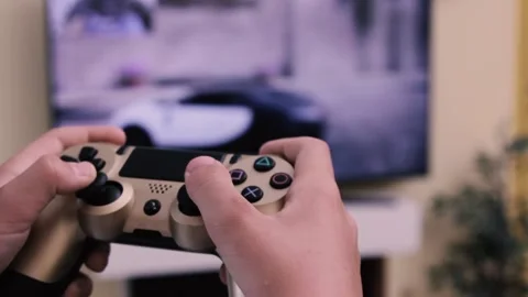 Hands of boy push buttons on console aga... | Stock Video | Pond5