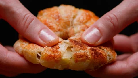 hands breaking pastries from puff pastry | Stock Video | Pond5
