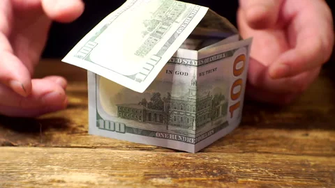 hands build a small house made of paper ... | Stock Video | Pond5