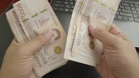 Hands counting a lot of thousands Thai b... | Stock Video | Pond5