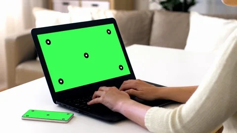 hands with green screen on laptop and sm... | Stock Video | Pond5