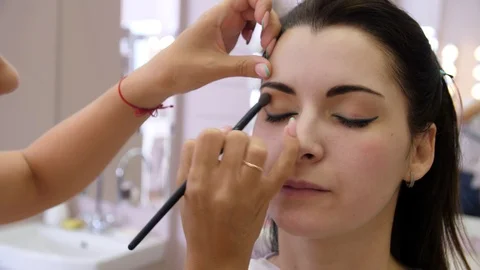 Hands make-up artist applied makeup on t... | Stock Video | Pond5