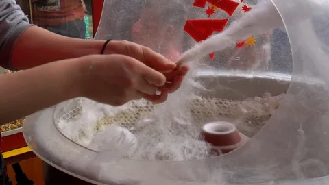 Hands making cotton candy machine with w... | Stock Video | Pond5