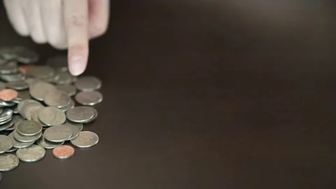 the hands of a man sorting stacked coins... | Stock Video | Pond5