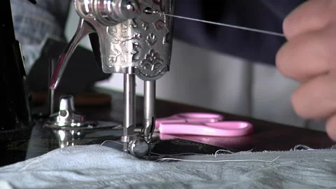 Hands of a Man Threading an Old Sewing M... | Stock Video | Pond5