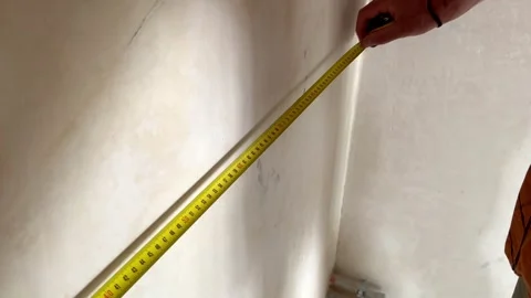 Hands with measuring tape during walls s... | Stock Video | Pond5