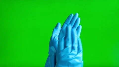 Hands in medical gloves are clapping on ... | Stock Video | Pond5