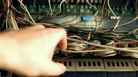 Hands moving wires in electrical control... | Stock Video | Pond5