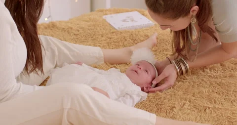 Hands nanny touching head child bed. The... | Stock Video | Pond5