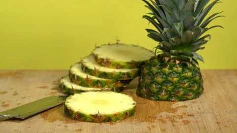 Hands peeling the skin off a pineapple s... | Stock Video | Pond5