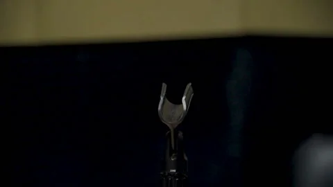 Hands placing a microphone in a micropho... | Stock Video | Pond5