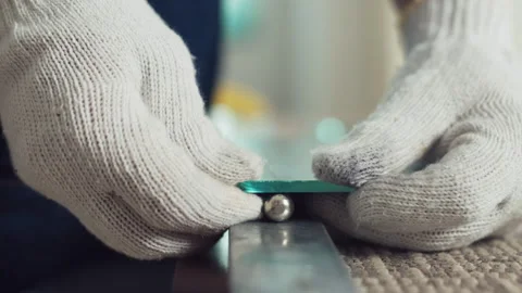 Hands of Puttier Splitting Glass in Half... | Stock Video | Pond5