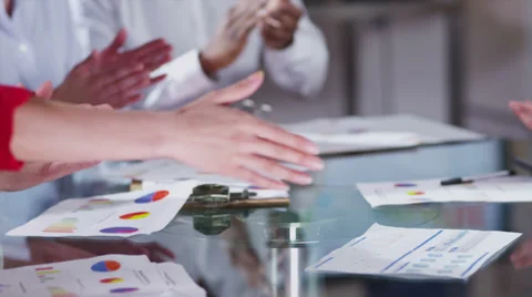 Hands reach across the table to shake on... | Stock Video | Pond5