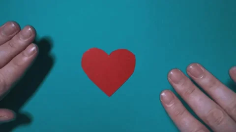 Hands Revealing Popping Red Heart In Blu... | Stock Video | Pond5