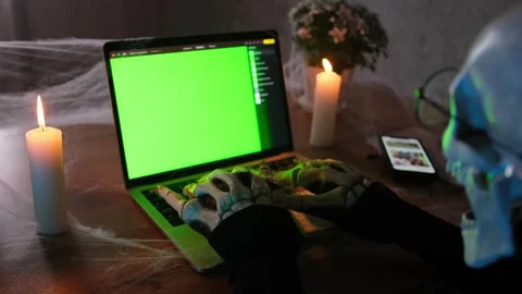 Hands in skeleton costume typing at lapt... | Stock Video | Pond5