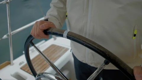 Hands of the skipper at the helm control... | Stock Video | Pond5