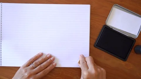 Hands Stamping Pages Of Notepad With Hea... | Stock Video | Pond5