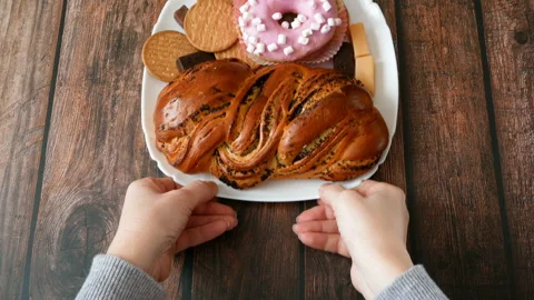 hands takes sweets with buns, candies an... | Stock Video | Pond5