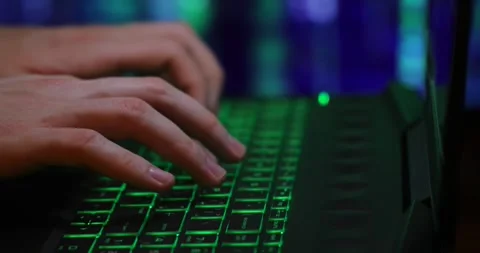 Hands typing code on a laptop keyboard, ... | Stock Video | Pond5
