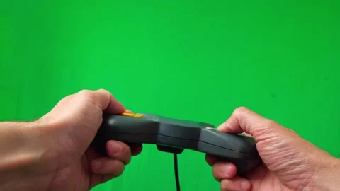 Hands Using Controller on Green Screen | Stock Video | Pond5