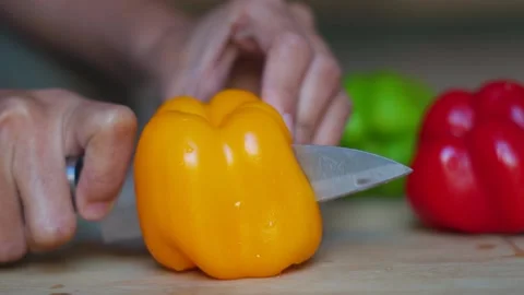 Hands of young female cutting fresh yell... | Stock Video | Pond5