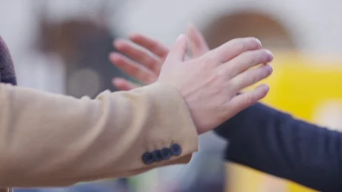 Handshake and fist bump in the city betw... | Stock Video | Pond5