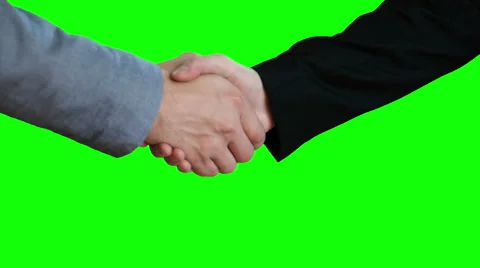 Handshake on the background of a green s... | Stock Video | Pond5