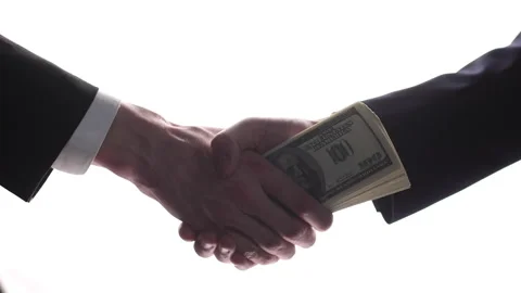 Handshake with money isolated on white b... | Stock Video | Pond5