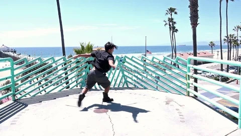 Handsome Asian man dancing on the pier | Stock Video | Pond5