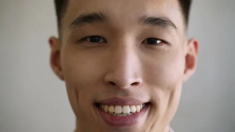 Handsome Asian man with dimples smiles l... | Stock Video | Pond5