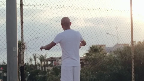 Handsome bald man standing against a gri... | Stock Video | Pond5