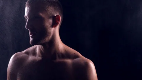 Handsome bodybuilder taking shower after... | Stock Video | Pond5