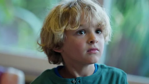 Handsome child boy face candid kid close... | Stock Video | Pond5