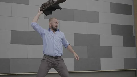 Handsome funny business man throwing his... | Stock Video | Pond5