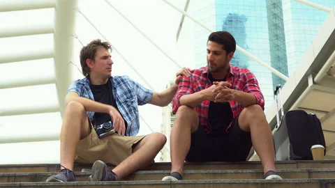 Handsome guy consoling his best friend b... | Stock Video | Pond5