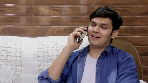 Handsome Indian college boy happily talk... | Stock Video | Pond5