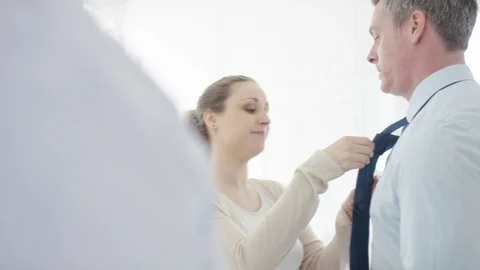 Handsome man getting his tie fixed by hi... | Stock Video | Pond5