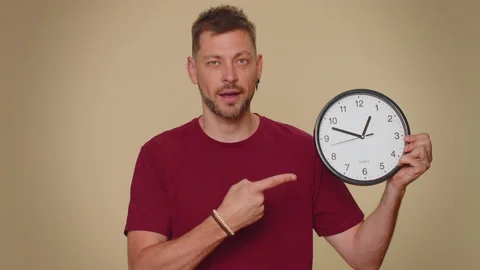Handsome man showing time on wall office... | Stock Video | Pond5