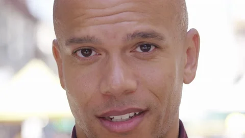 Handsome mixed race man looks up to came... | Stock Video | Pond5