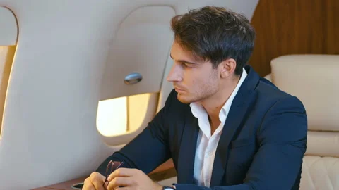 Handsome Rich Man Flying in Private Jet ... | Stock Video | Pond5