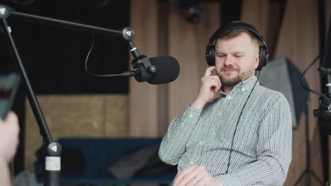 Handsome smiling radio host working in s... | Stock Video | Pond5