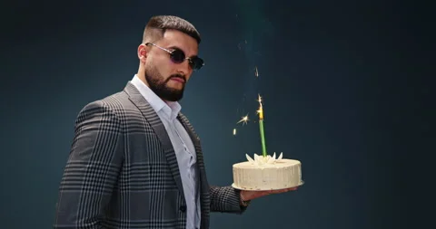 Handsome young man holding cake in the s... | Stock Video | Pond5