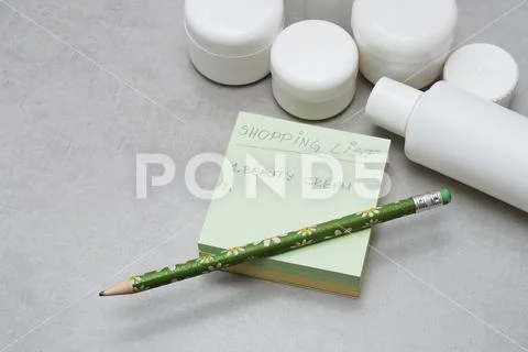 Photograph: A handwritten shopping list on A Post-it Notes #152916782