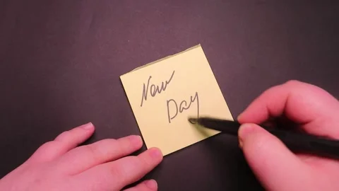 Handwritten text on sticker on black bac... | Stock Video | Pond5